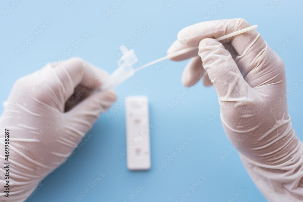 Close up doctor hand taking a swab for corona virus sample from ...