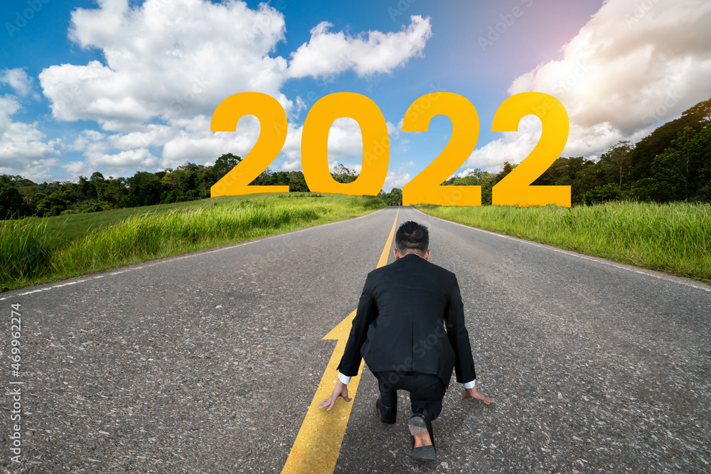 The 2022 New Year journey and future vision concept . Businessman ...