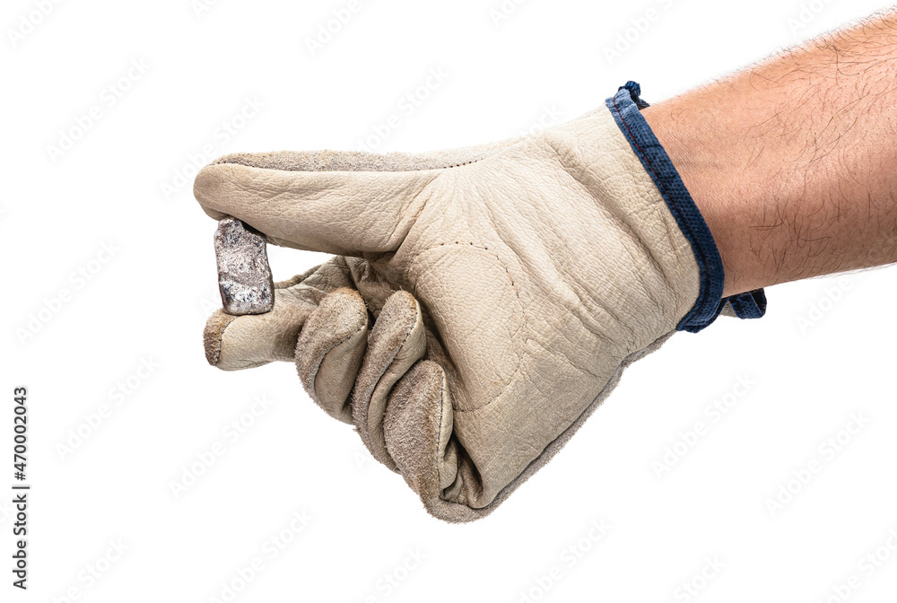 miner hand with protective glove holding silver color ore, metallic ...
