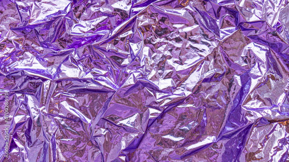 Purple holographic iridescent metallic foil. Selective focus. Real ...