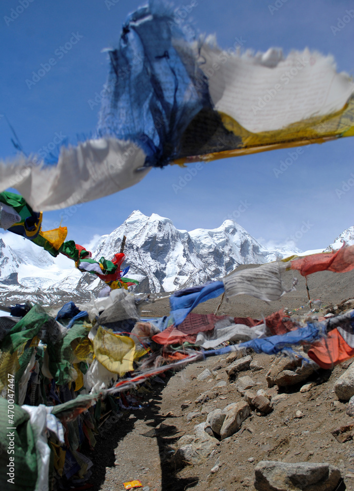 Prayer flags flutter on the backdrop of Mt. Khangchenghao (male) and Mt ...