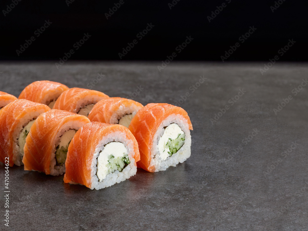 Japanese sake sushi roll with cucumber and cream cheese inside roll ...