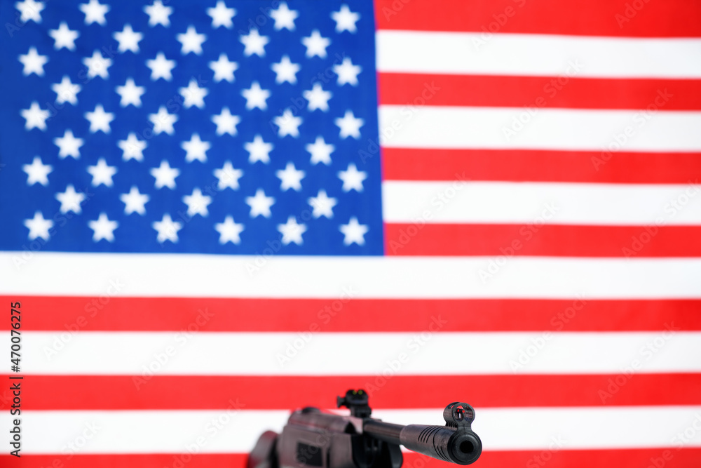 Weapons and American flag background. Rifle aiming from the US flag ...