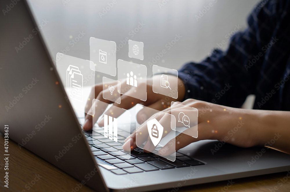 a business man who uses a computer to manage documents document ...