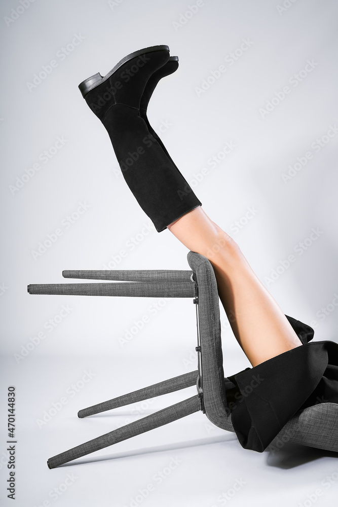 woman lies in boots on a white background. new collection of women's ...