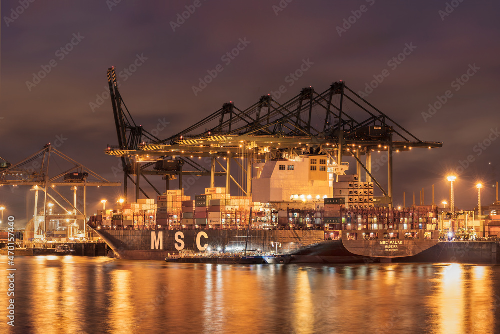 ANTWERP-NOV 13, 2021. Illuminated container terminal at twilight ...