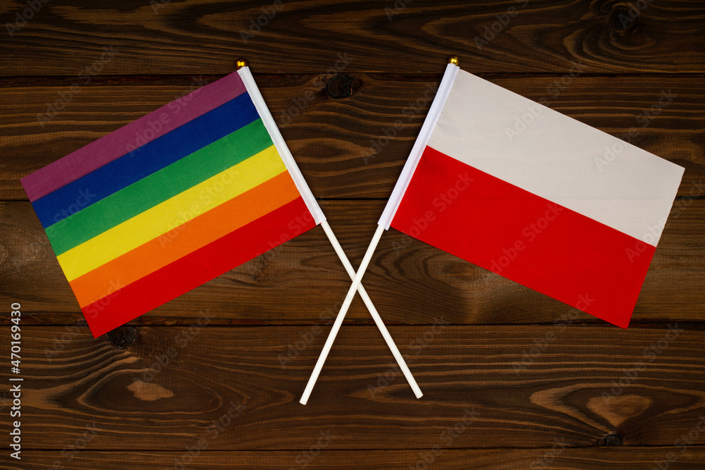 Rainbow flag LGBT and flag of Poland on beautiful brown background with ...
