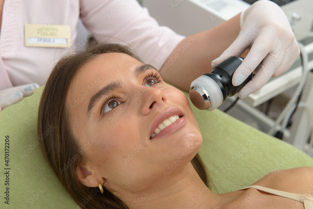 Non injection mesotherapy. Doctor and patient in clinic. Rejuvenation ...