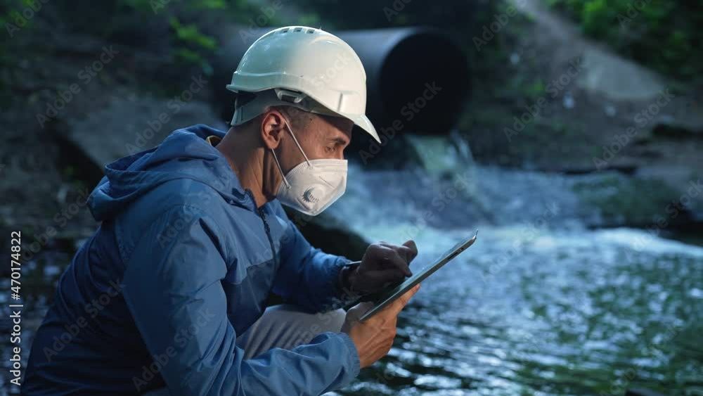 Video Stock Engineer worker checking water quality of river. Wastewater ...