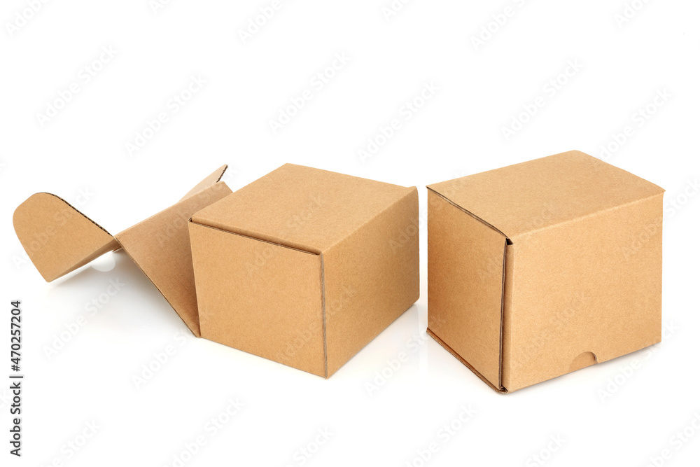 Two cube shaped cardboard box containers one with lid open, one shut on ...