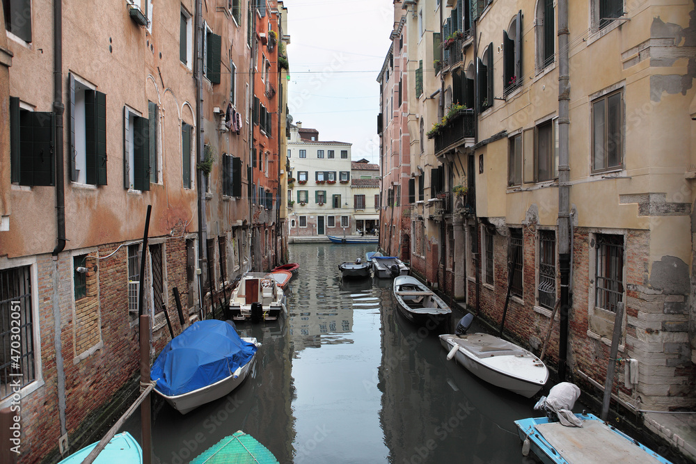 Typical view of a narrow canal between colorful historic buildings in ...