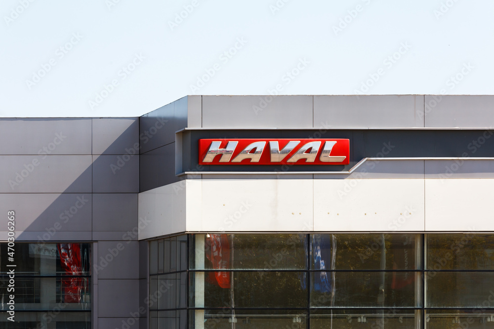 Haval logo on dirty car dealership building at sunny day - Haval owned ...