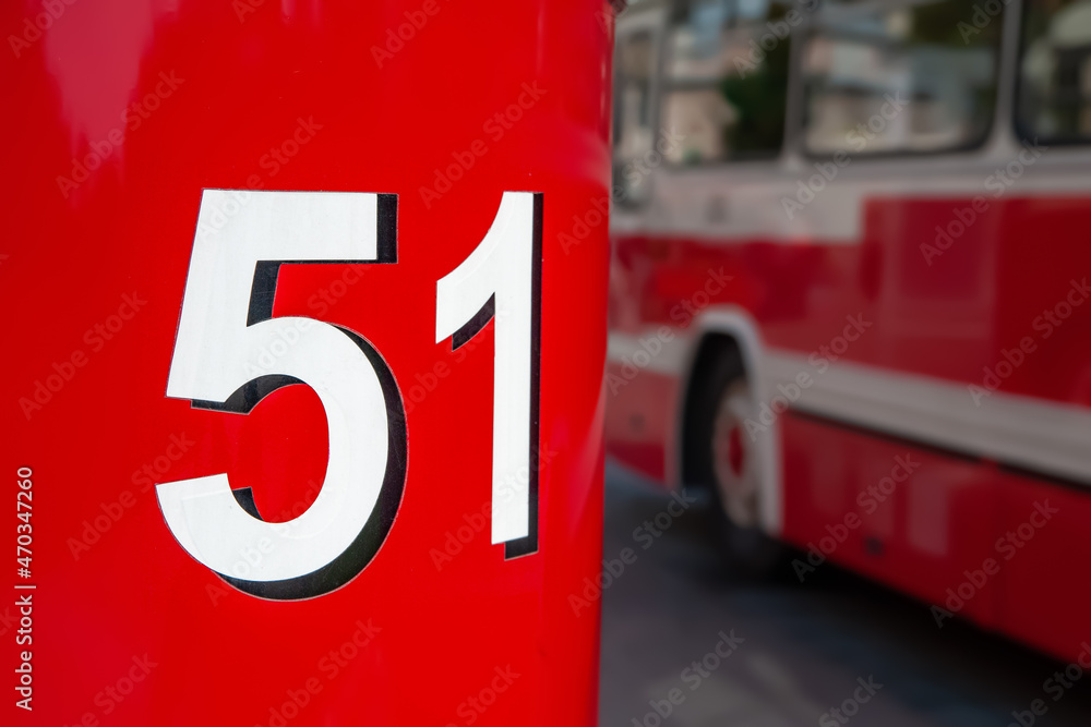 Bus number. Number 51 aboard a red old passenger bus. Retro transport ...
