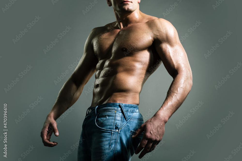 Sexy muscle strong man guy in jeans on gray isolated background. Ideal ...