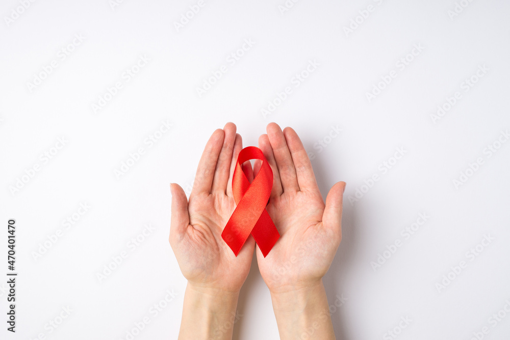 First person top view photo of woman's hands holding red satin ribbon ...