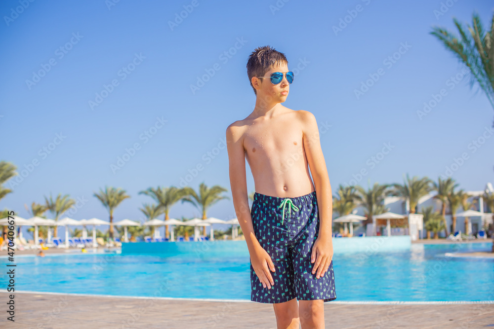 Boy rest in vacation. Teenage boy in swimming pool, Children lifestyle ...