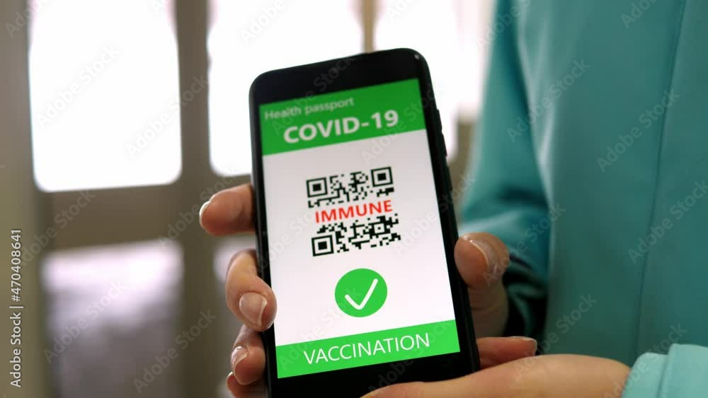 Reading a QR code using a smartphone. Using QR code to check COVID-19 ...