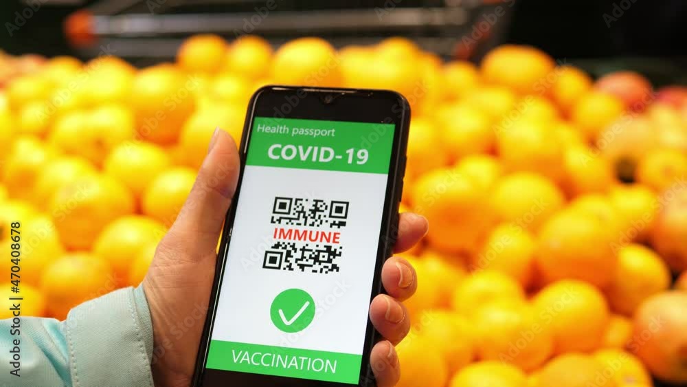 Reading a QR code using a smartphone. Using QR code to check COVID-19 ...