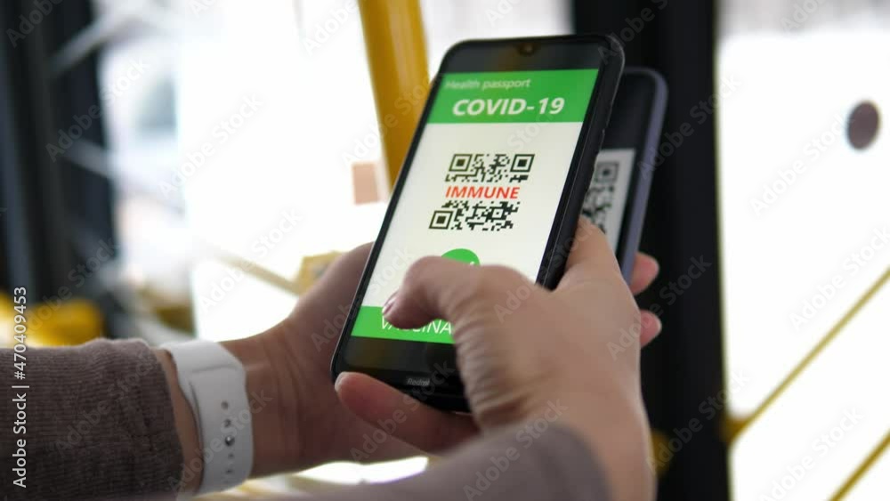Reading a QR code using a smartphone. Using QR code to check COVID-19 ...