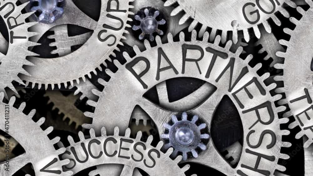 Group of rotating tooth wheels with Partnership sign imprinted on metal ...