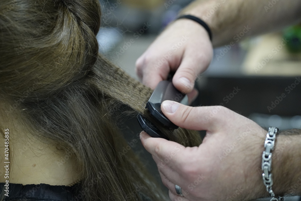 Shirring long hair in a hairdresser's shop is a frequently ordered ...