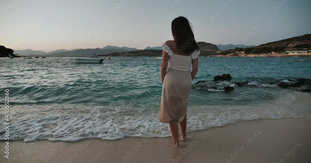 Woman walking on beach in Ksamil Islands, Albania. Ionic Sea, Turquoise ...