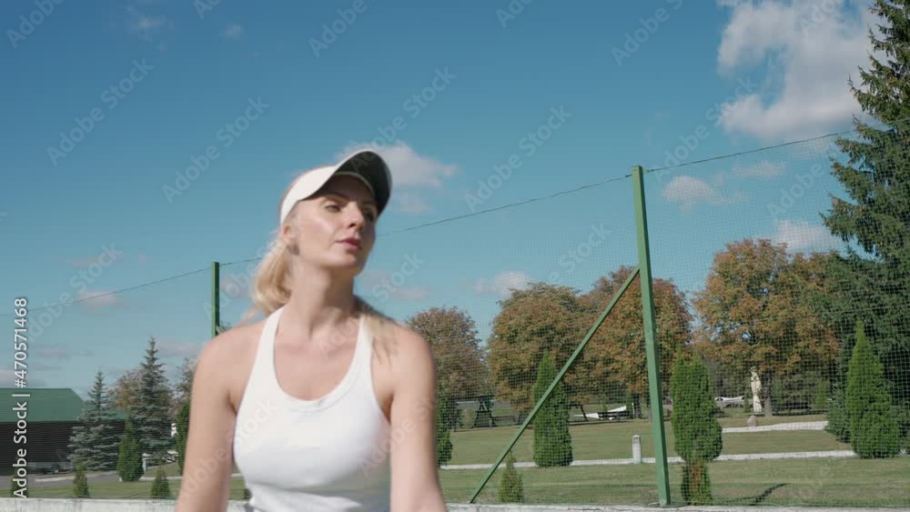 Pro tennis player hits the ball with a racket, practice game on the ...