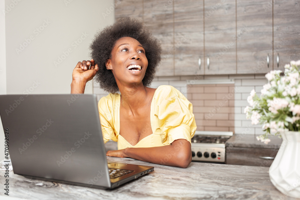 Portrait of beautiful African American freelancer woman, table in ...