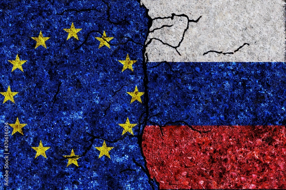Russia and European Union painted flags on a wall with grunge texture ...