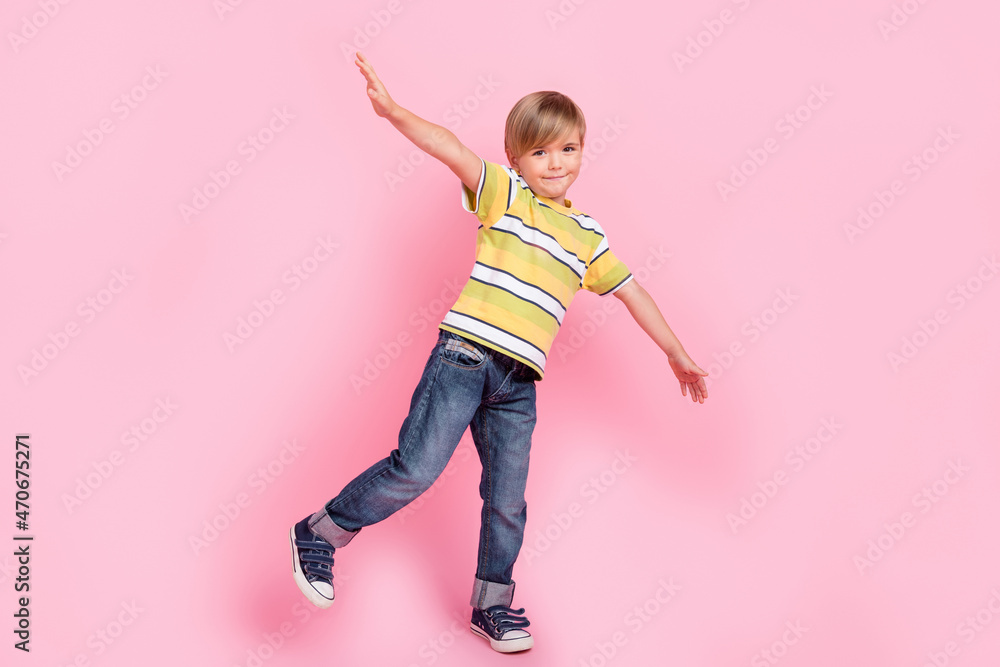 Full size photo of young little boy enjoy raise hands fly wings plane ...