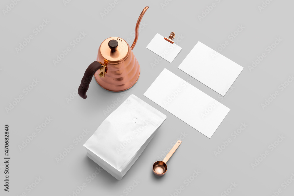 Blank coffee packaging with different white cards, copper spoon and pot ...