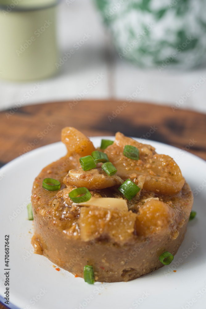 Cow skin meat cooked with spicy peanut sauce with onion leaves as ...