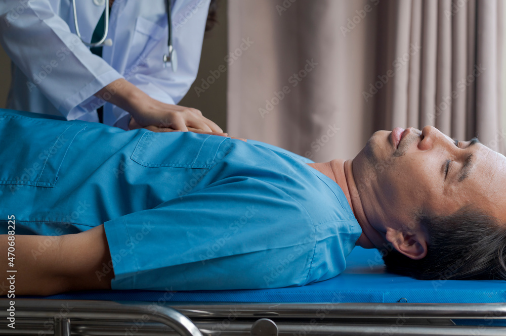 Doctor doing cardio pulmonary resuscitation on an unconscious patient ...