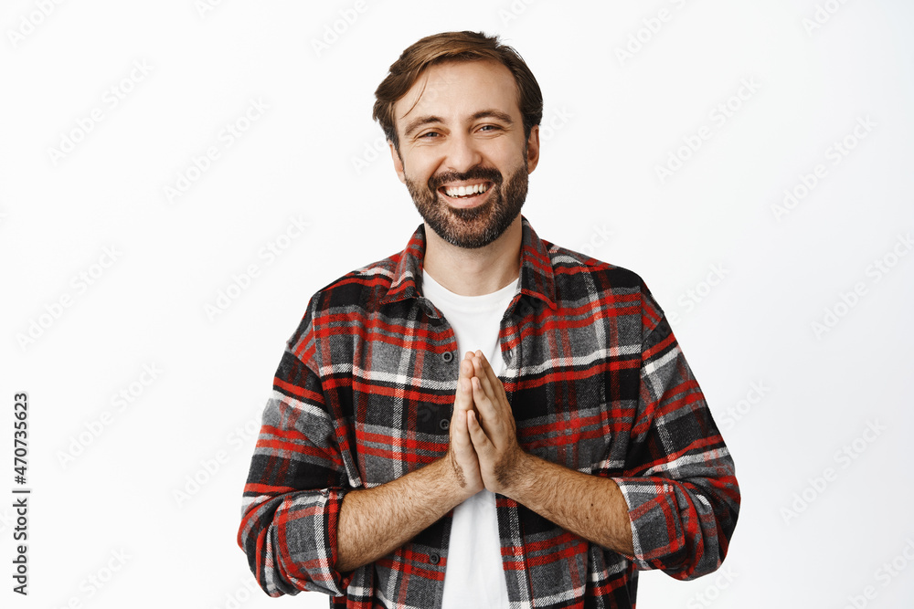 Smiling happy adult man say thank you, shows namaste appreciation ...