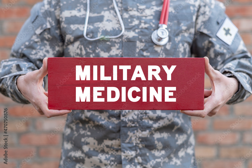 Concept of modern innovative military medicine. Army doctor hold red ...