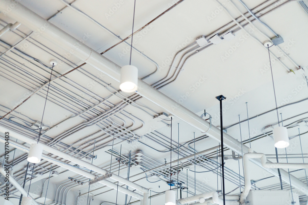 white rustic ceiling background with pipes and conduits Stock Photo ...