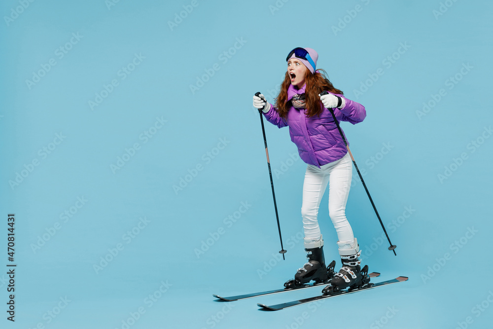 Full body skier scared fearful panicked woman 20s wear warm purple ...