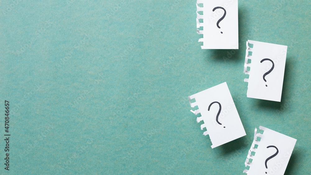 Question mark on ripped note on green background. Thinking, solution ...