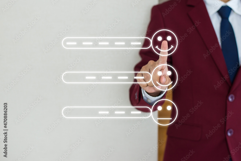 Foto de Businessman wearing red suit pressing smiley face emoticon and ...