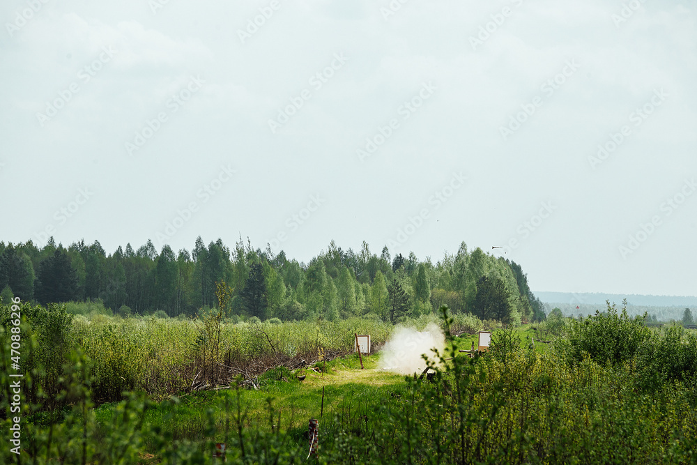 the explosion of a projectile when hitting a target on a military ...