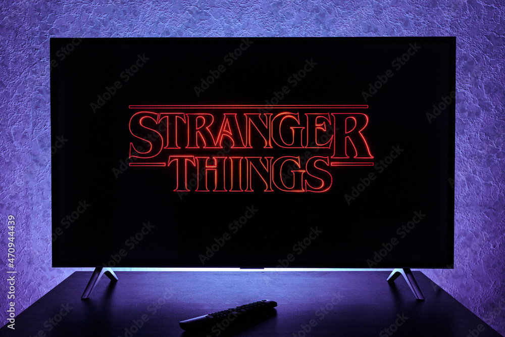 Watching Stranger Things television show on TV. Stranger Things is an ...