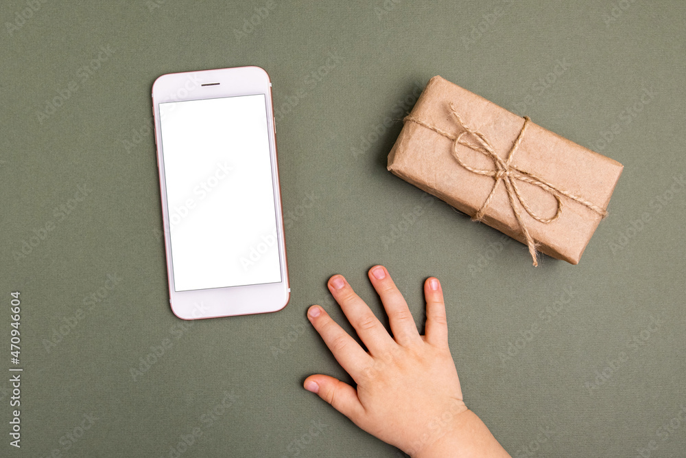 Christmas holidays technology background. Mobile phone in kid hands and ...