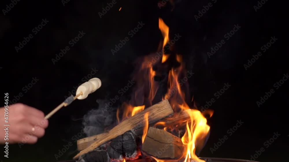 Marshmallows On Stick Roasting Over Campfire On Black Background ...