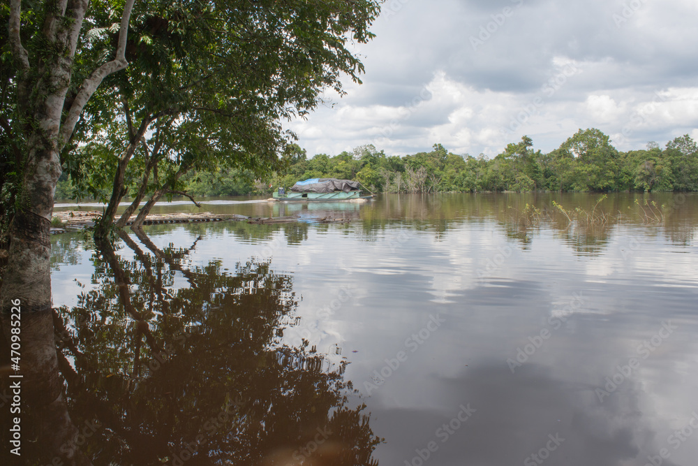 merchant ships crossing the Kahayan river, Central Borneo, will stop at ...