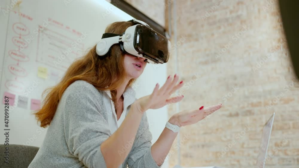 caucasian female programer wearing vr goggle headset virtual digital ...