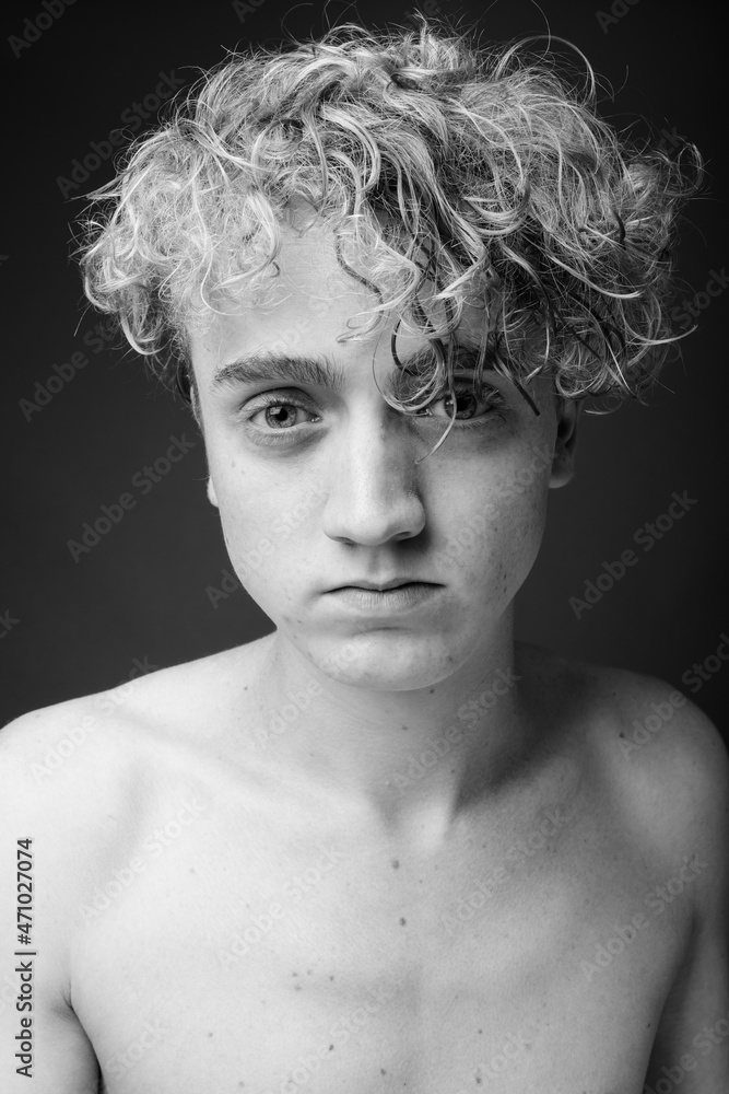 Portrait Of Shirtless Boy Against Black Background Stock Photo | Adobe ...