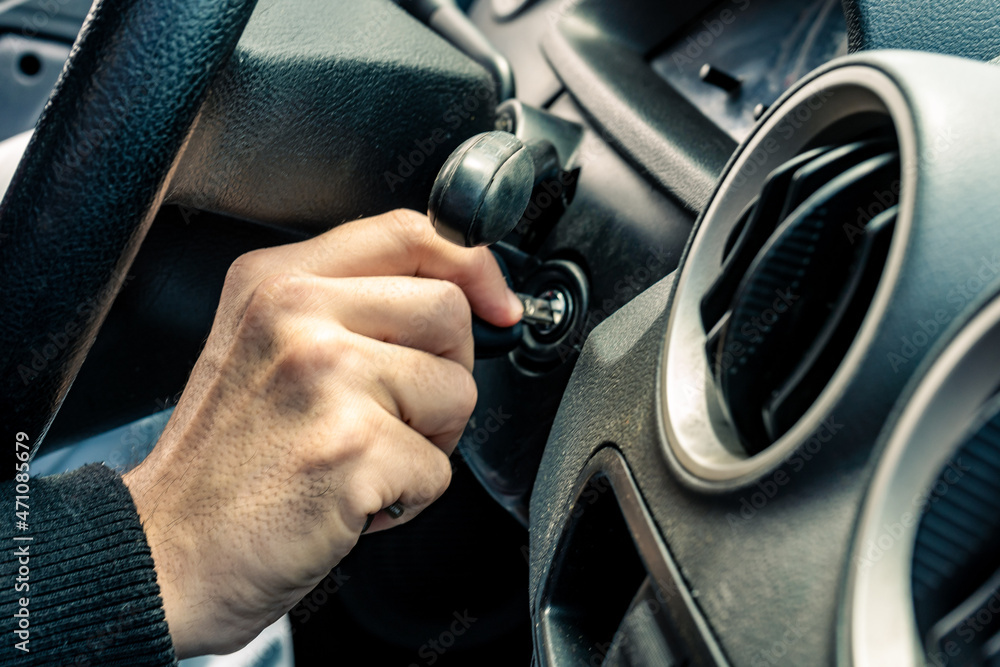 Hand holding car key for starting the car. Stock Photo | Adobe Stock