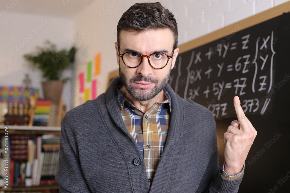 Angry disrespectful teacher showing middle finger in class Stock Photo ...