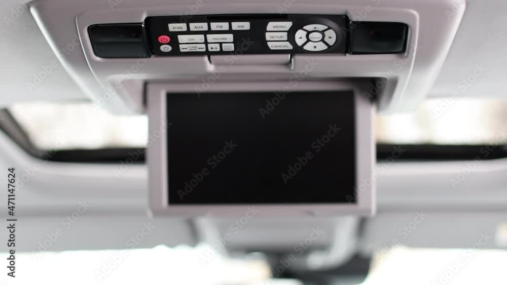 Part of the car's entertainment multimedia system. Overhead monitor. a ...