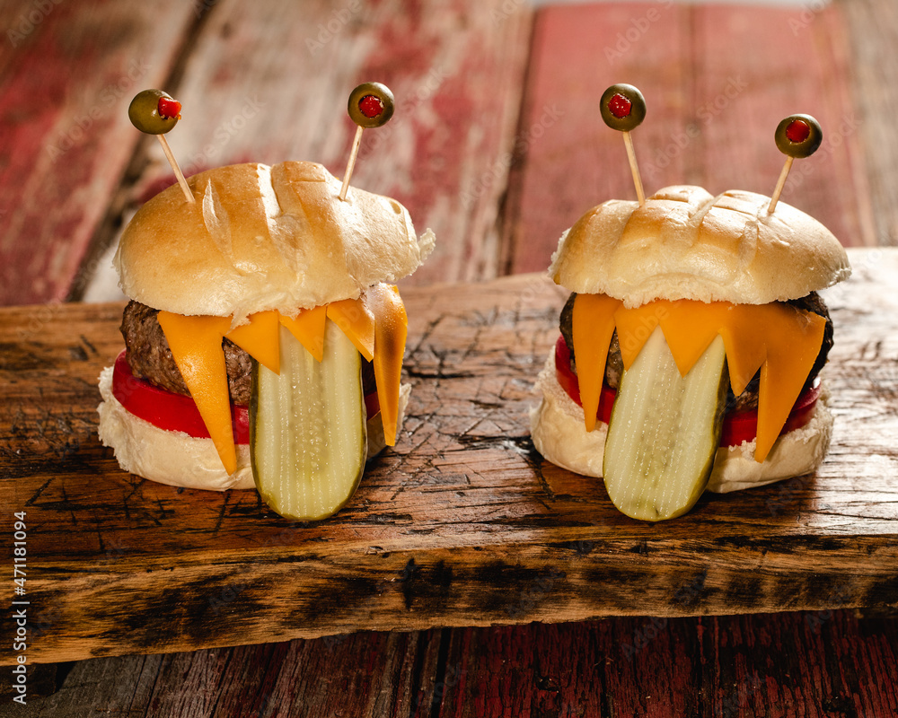 Cheese burgers designed to look like Aliens using cheese pickles and ...